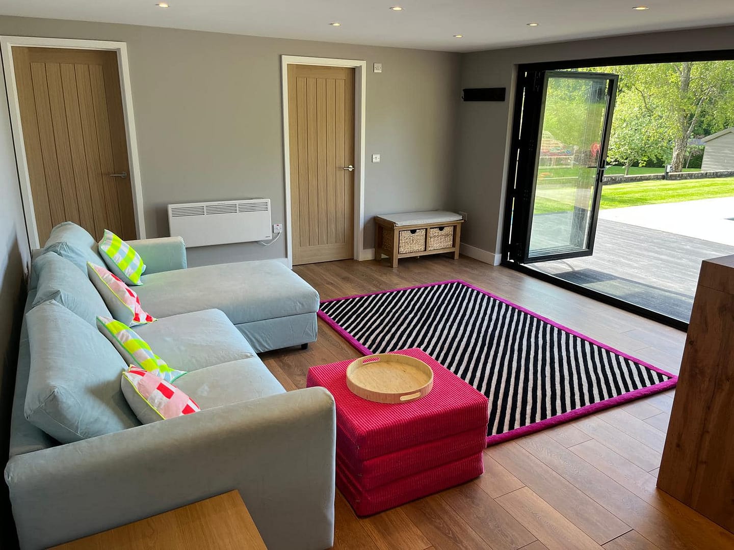 Wo-Man Cave Garden Rooms With Aluminium Bifold Doors | UK Doors Online